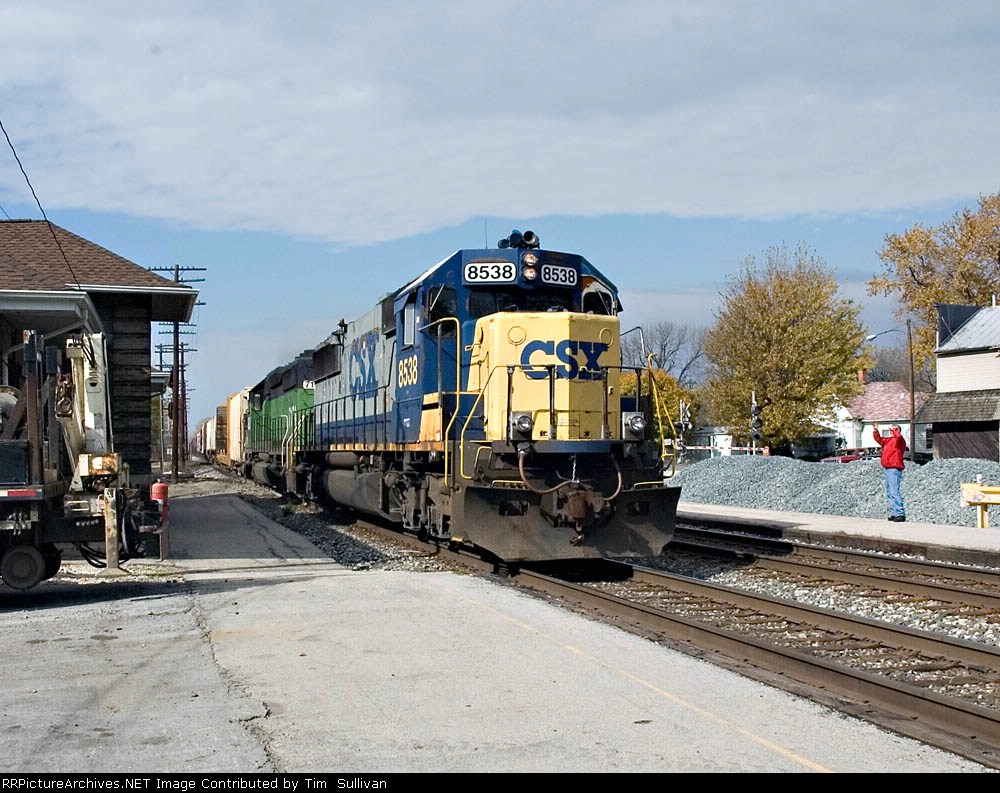 CSX 8538 with a manifest freight passes the station e/b